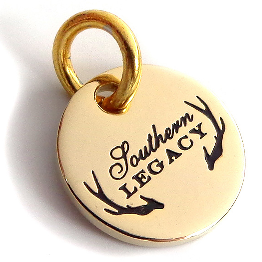 Round metal logo tags with engraved letters